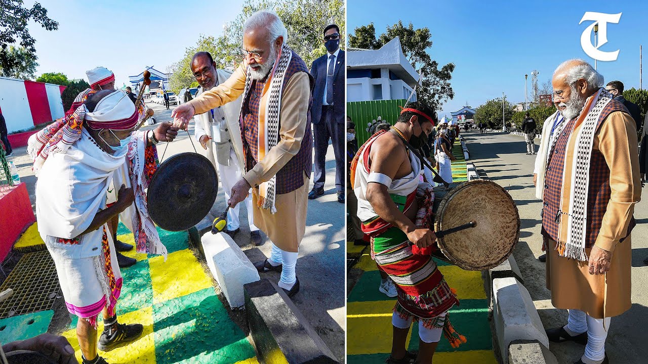 PM Narendra Modi plays traditional musical instruments with tribals in ...
