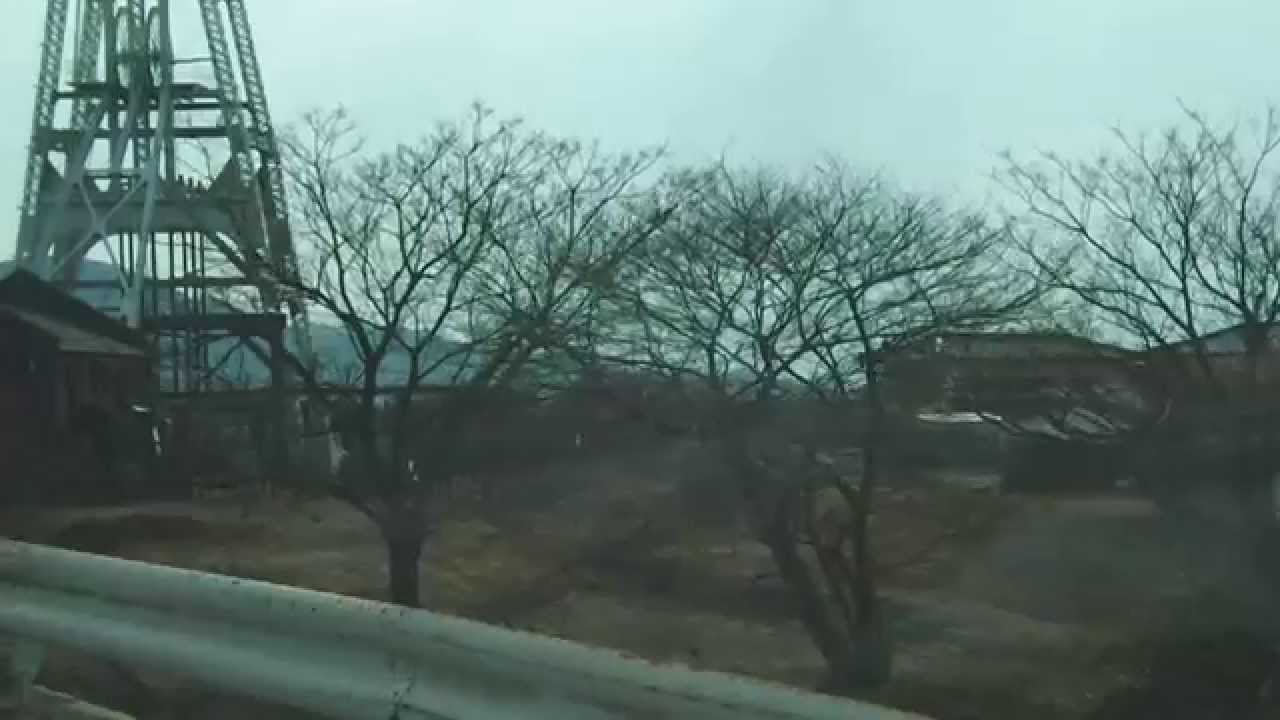 Antique bridge of a coal mine railroad and coal mine shaft turret ...