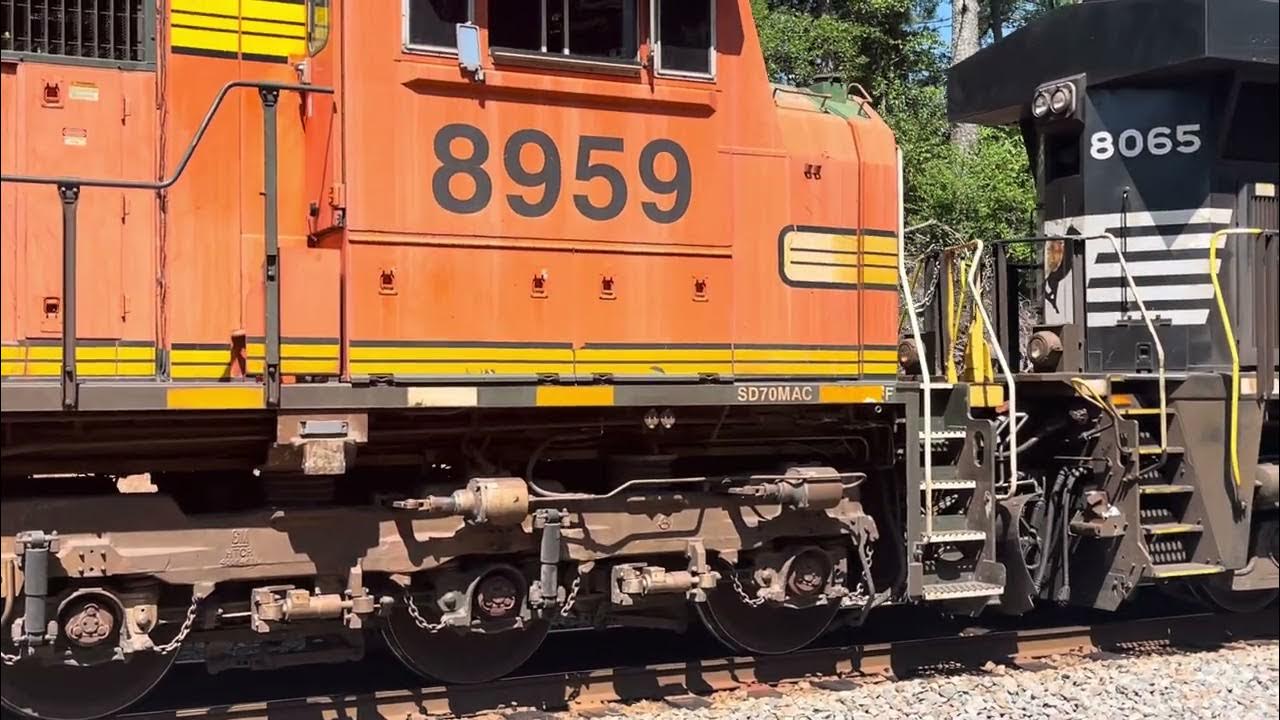 NS 8065 & A WFRX locomotive sit idle on 154 as they wait on 27A with Central of GA trailing ...