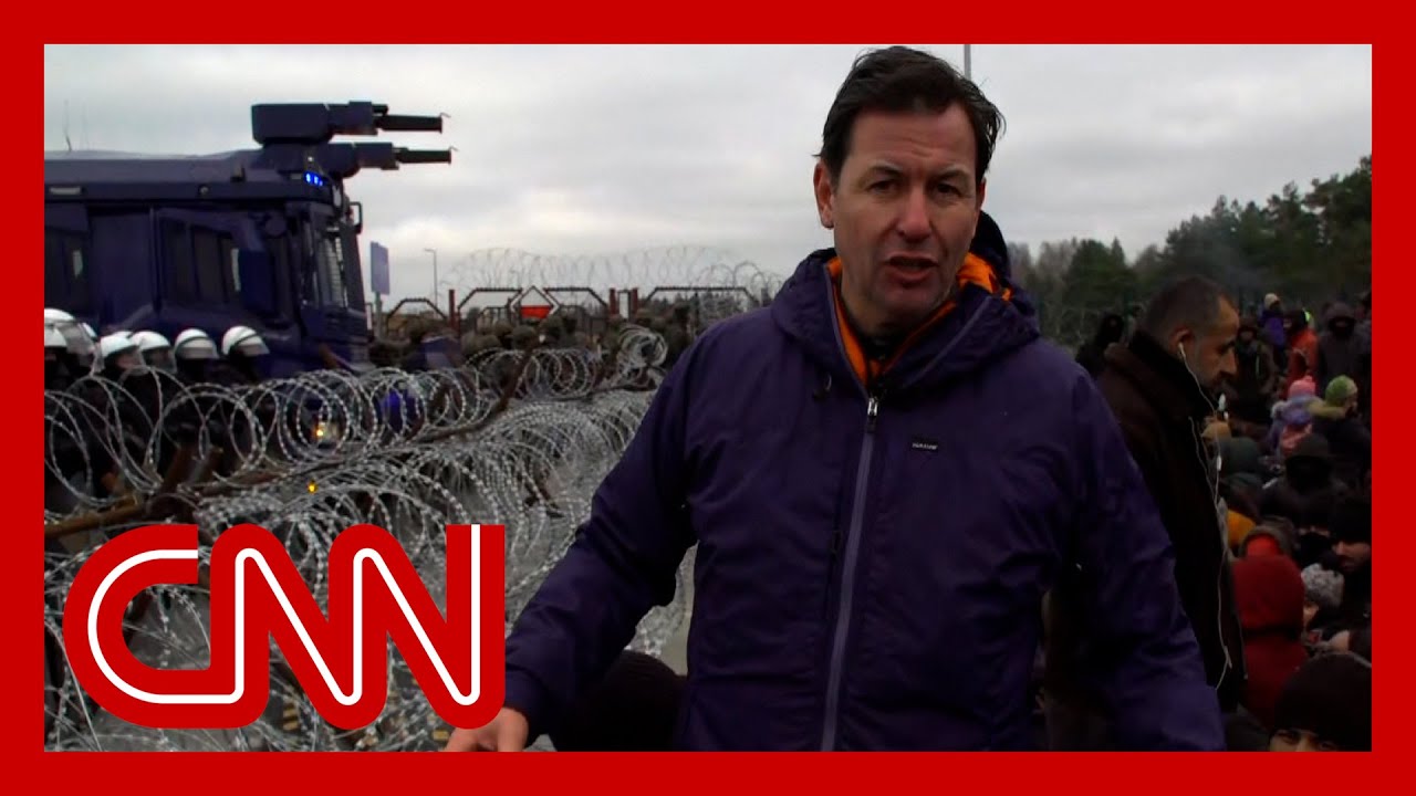 Water cannons aimed at migrants in tense border standoff - YouTube