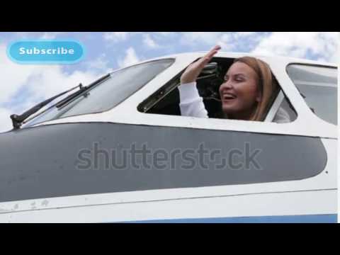 Pretty woman pilot  an airplane | Stock Footage