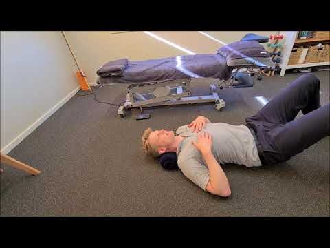 Using a rolled towel to relieve postural neck pain - YouTube