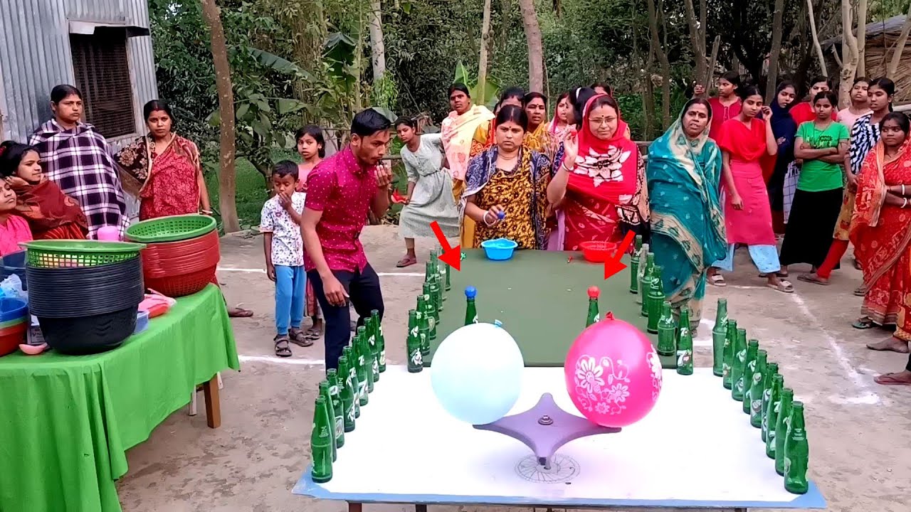 Another new game in the village is the bottle ball throwing competition ...