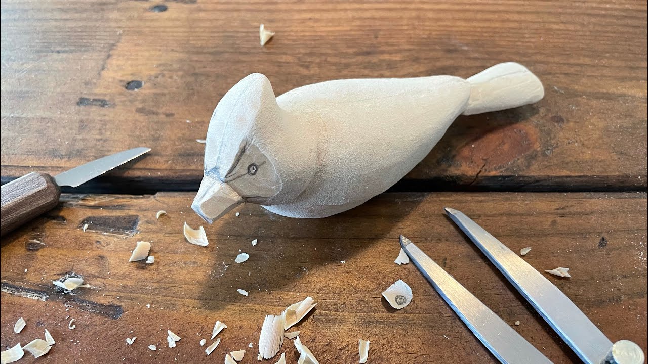 Wood carving a bird with a turned head - YouTube