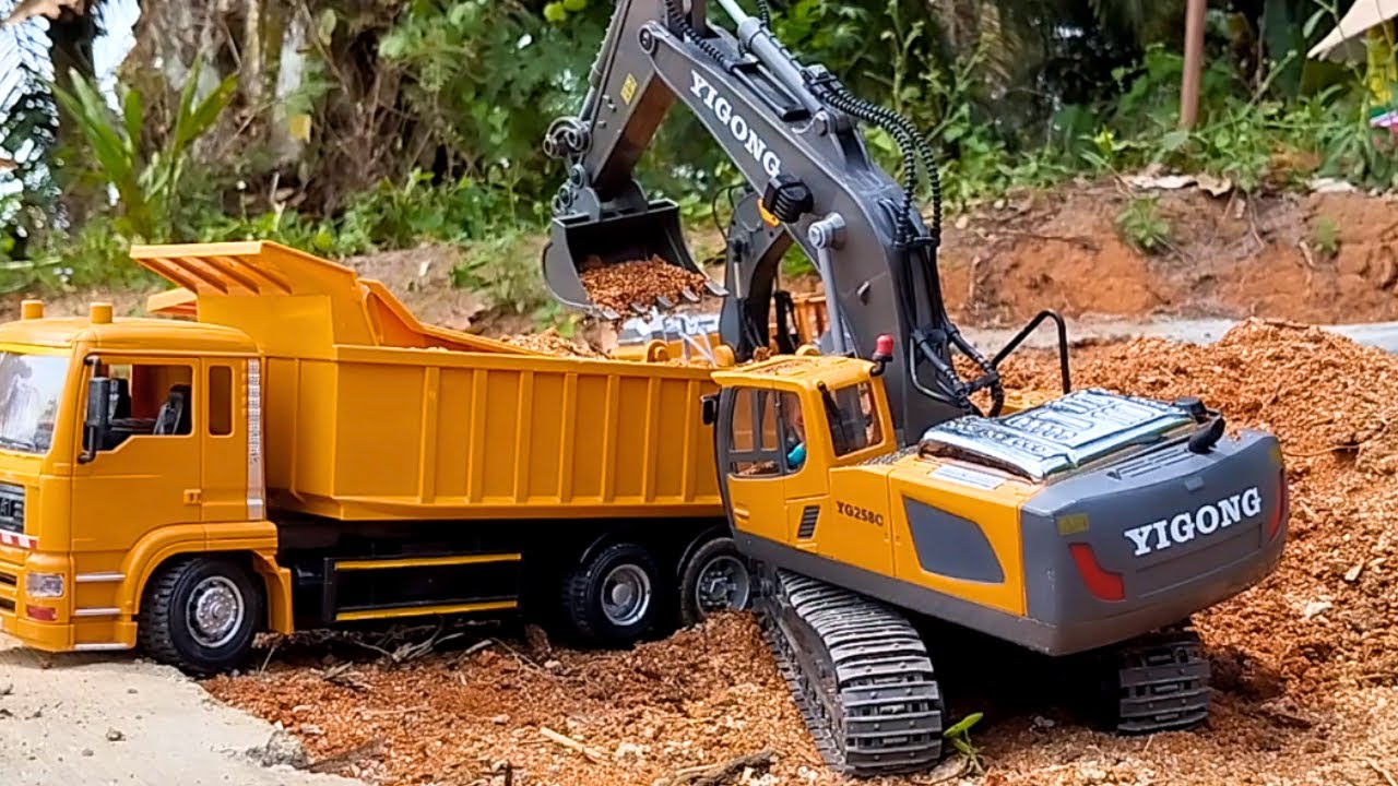 DUMP TRUCK, EXCAVATOR AND PICK UP, LOADING SOIL FOR ROAD REPAIRS, PICK ...