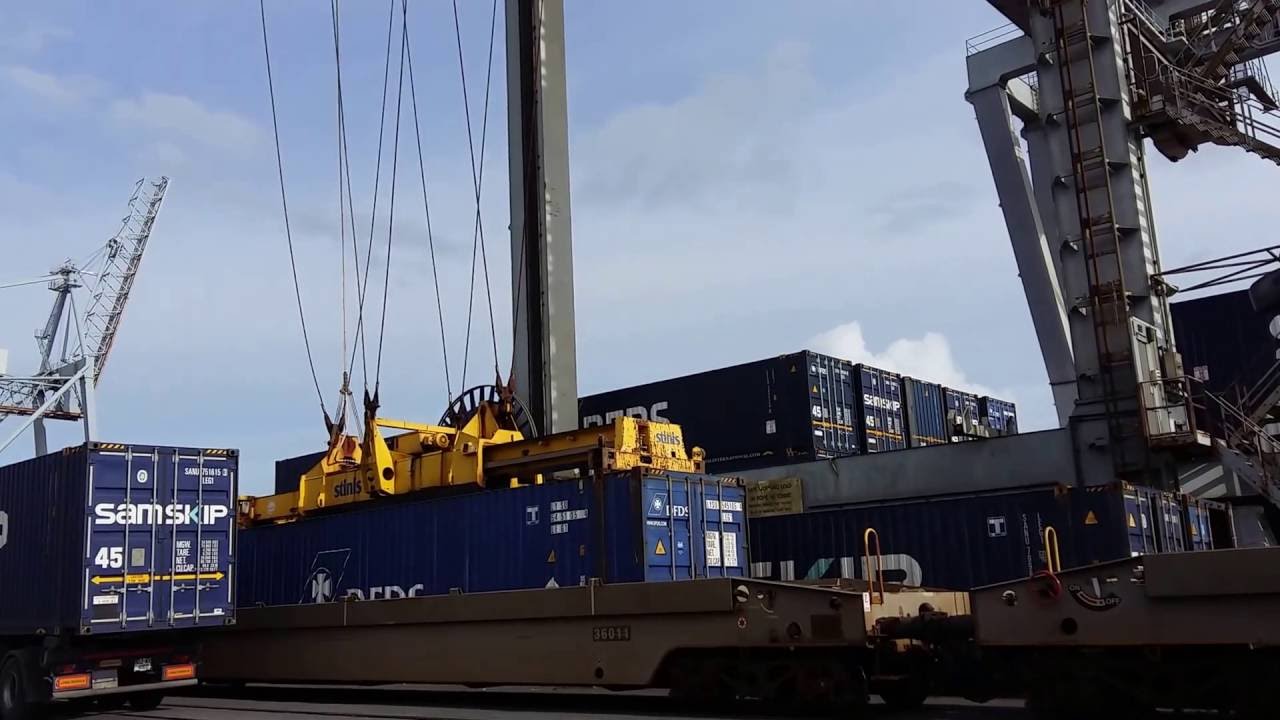 Containers unloaded from train - YouTube