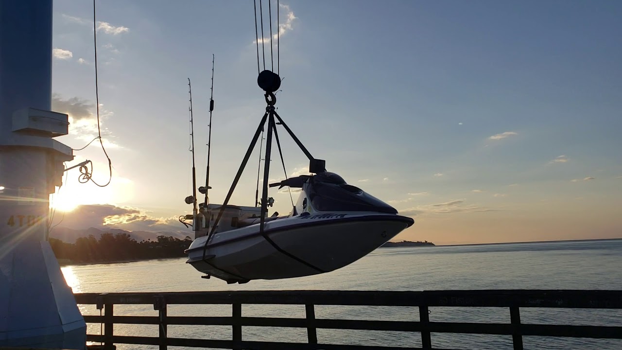 Launching boat at goleta pier - YouTube