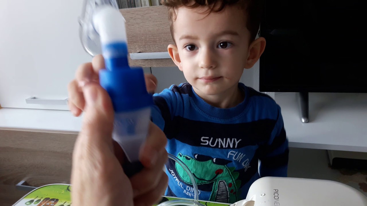 3 years old baby with flu enjoying self inhalation with nebulizer - YouTube
