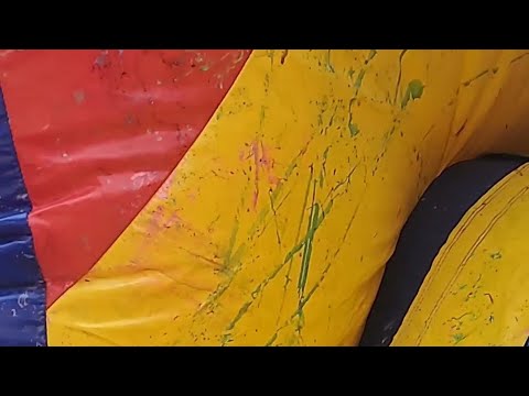 Inflatable obstacle course covered in water based paint - pressure ...