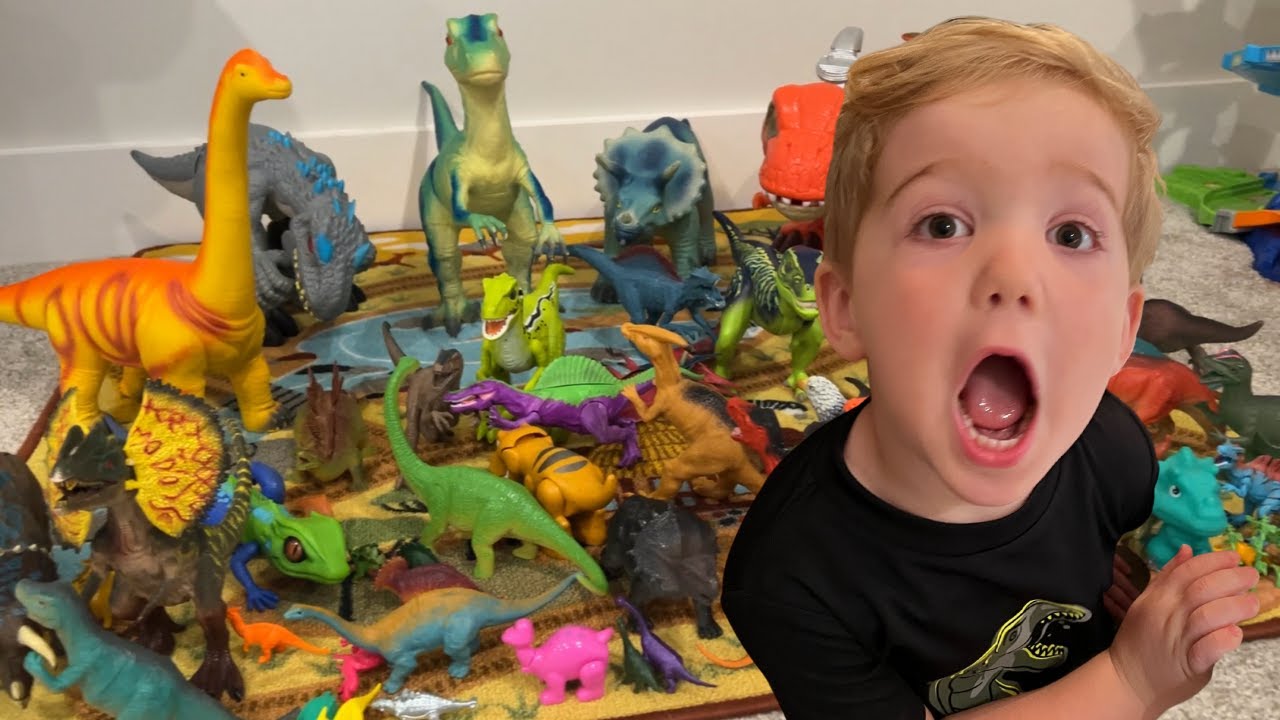 LEARNING about DINOSAURS with Cullen! T-rex Velociraptor Triceratops ...