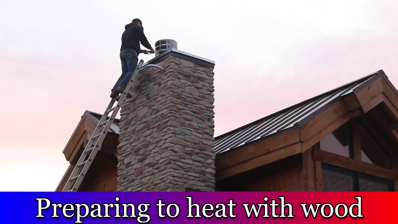 Getting everything ready to start heating our log home with wood. - YouTube
