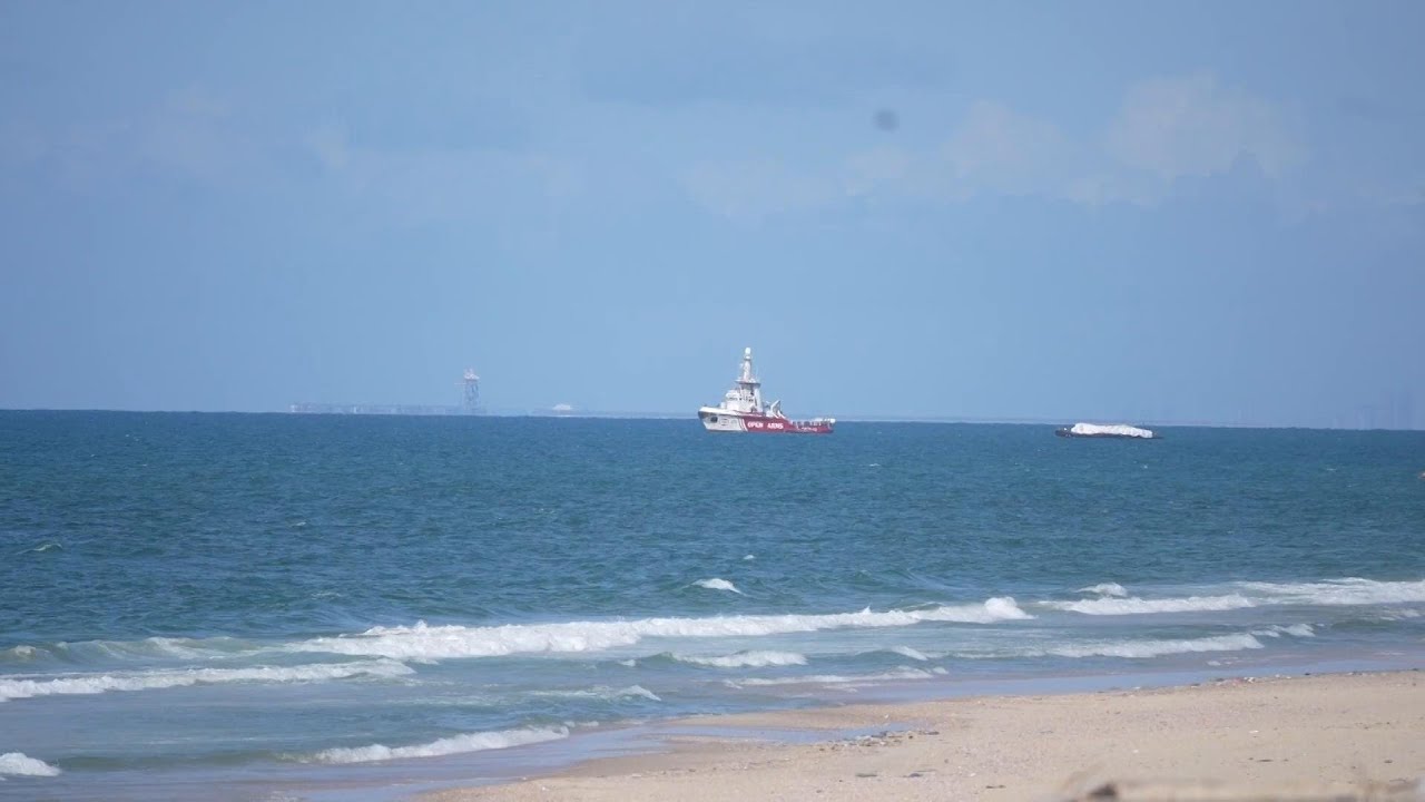 Ship carrying 200 tons of aid approaches coast of war-struck Gaza - YouTube