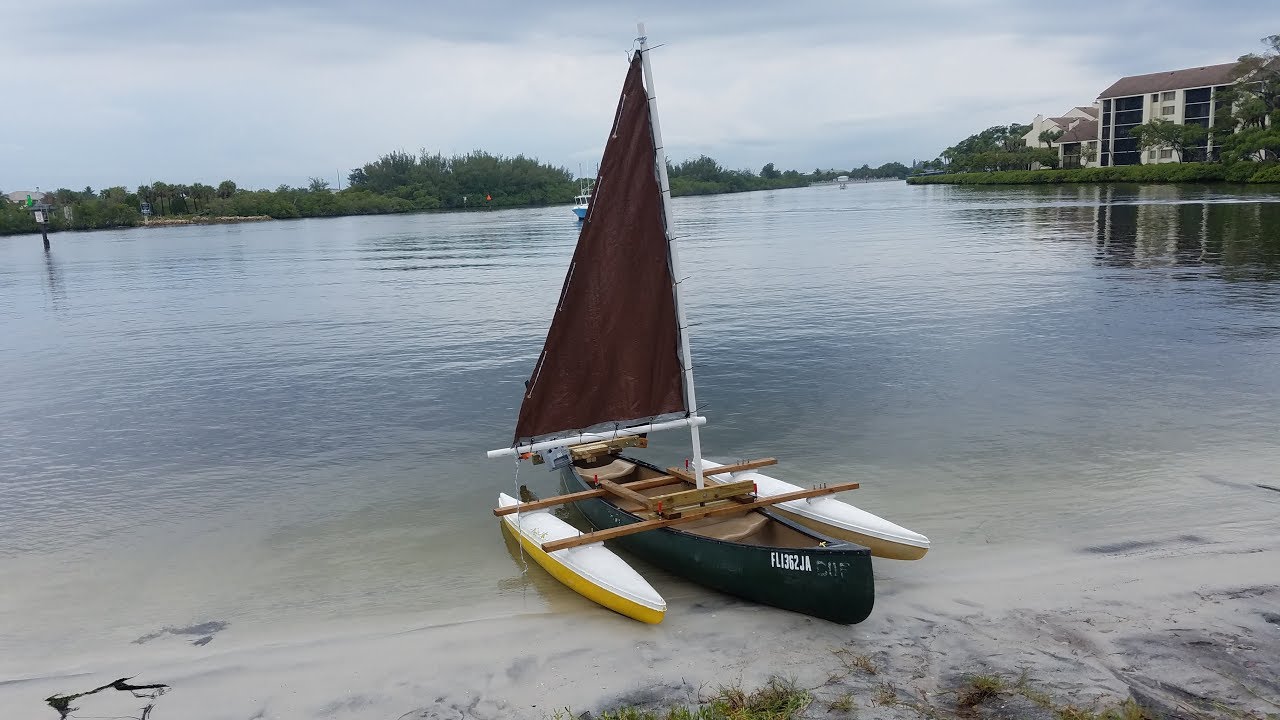 Discovery 158 canoe with the Hydrobike floats and the sail from a tarp ...