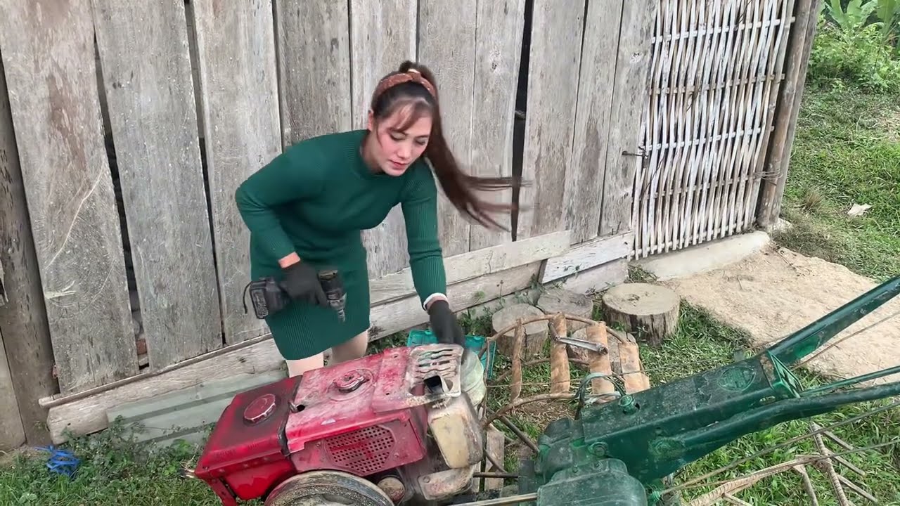 The girl repaired a large capacity tractor and installed an iron door ...
