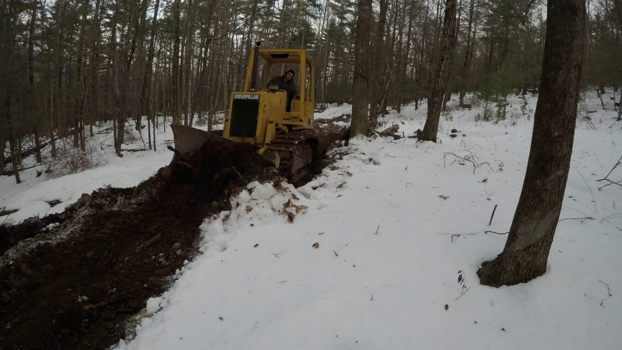 Bulldozer pushing dirt - YouTube