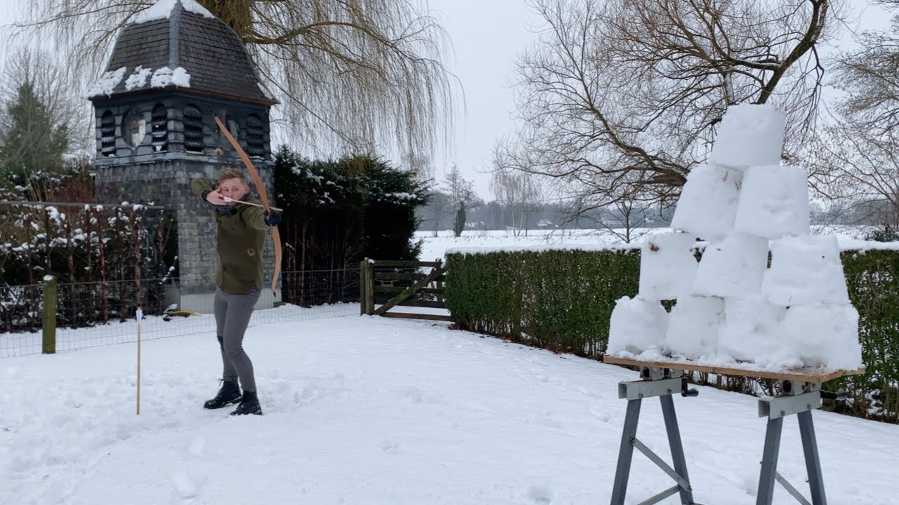 Shooting Snow with a Bow & Arrow - YouTube