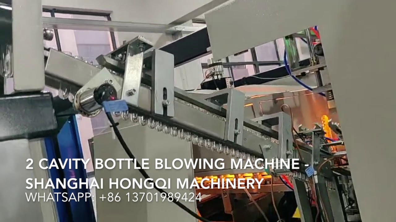 bottle blowing machine and preform feeding machine - YouTube