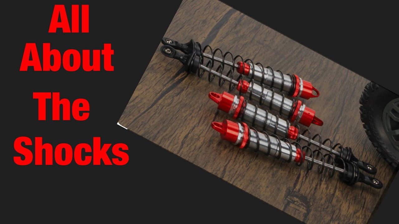 Building xmaxx from scratch!!! Putting shocks together and bumper on ...