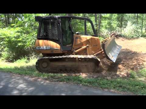 Case dozer pushing trees - YouTube