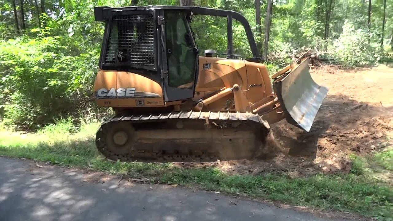 Case dozer pushing trees - YouTube