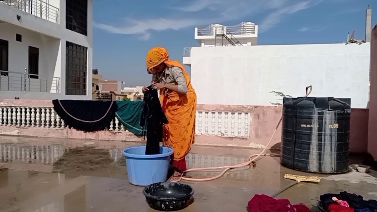 Indian housewife washing cloth by hand.washing lehenga lugadi washing ...