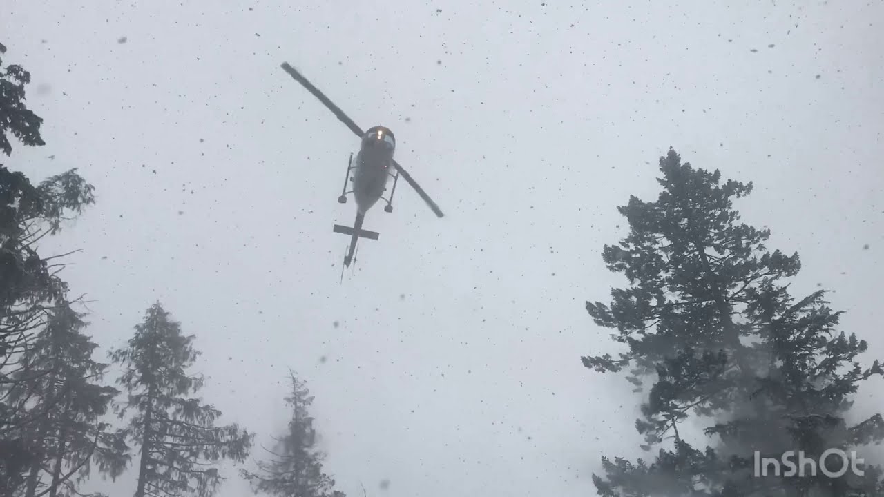 Flying a helicopter in a blizzard | landing on a mountain side in near ...