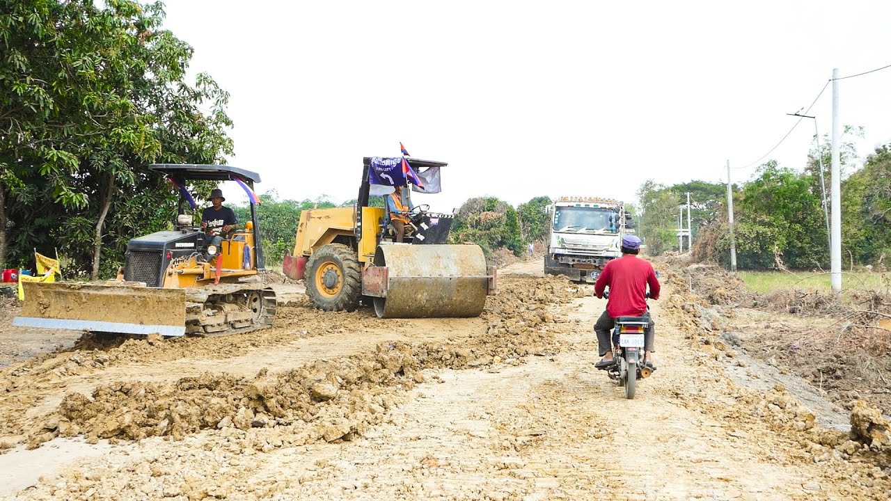 Dump Truck Filling Up To Build Embankment On Commune Road With ...