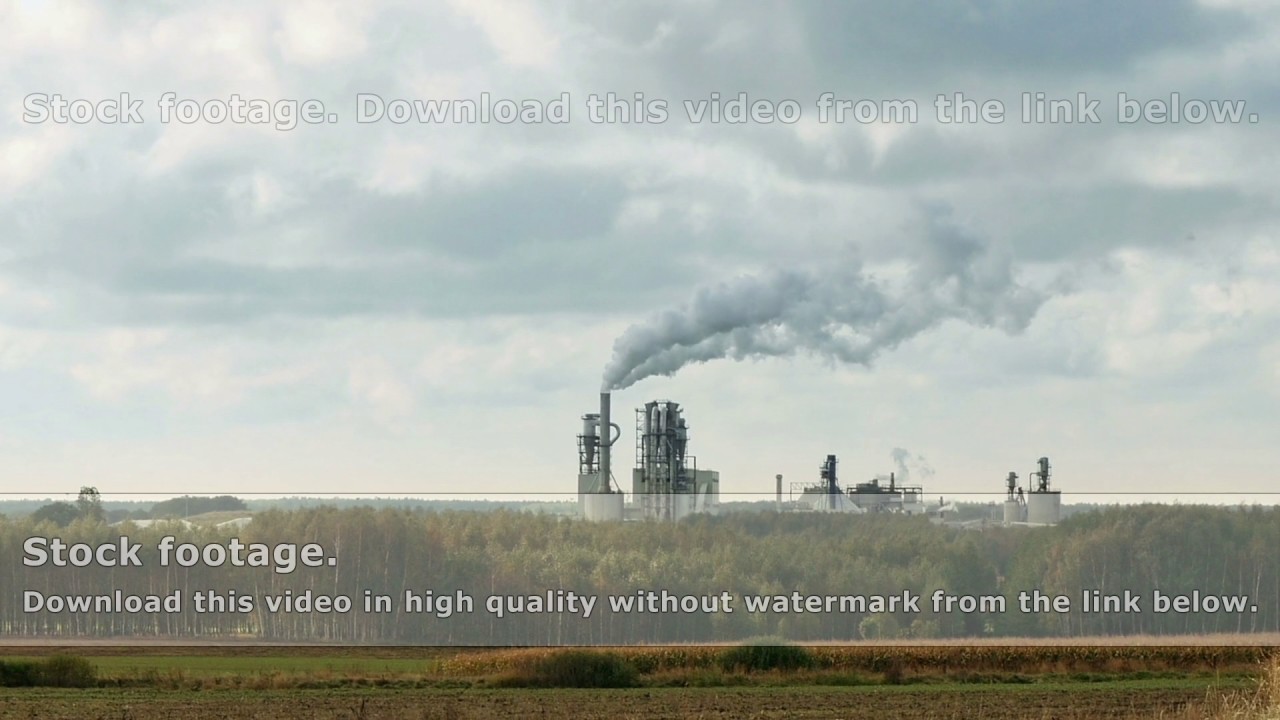 Factory smoke stack and pipes puff into air - YouTube