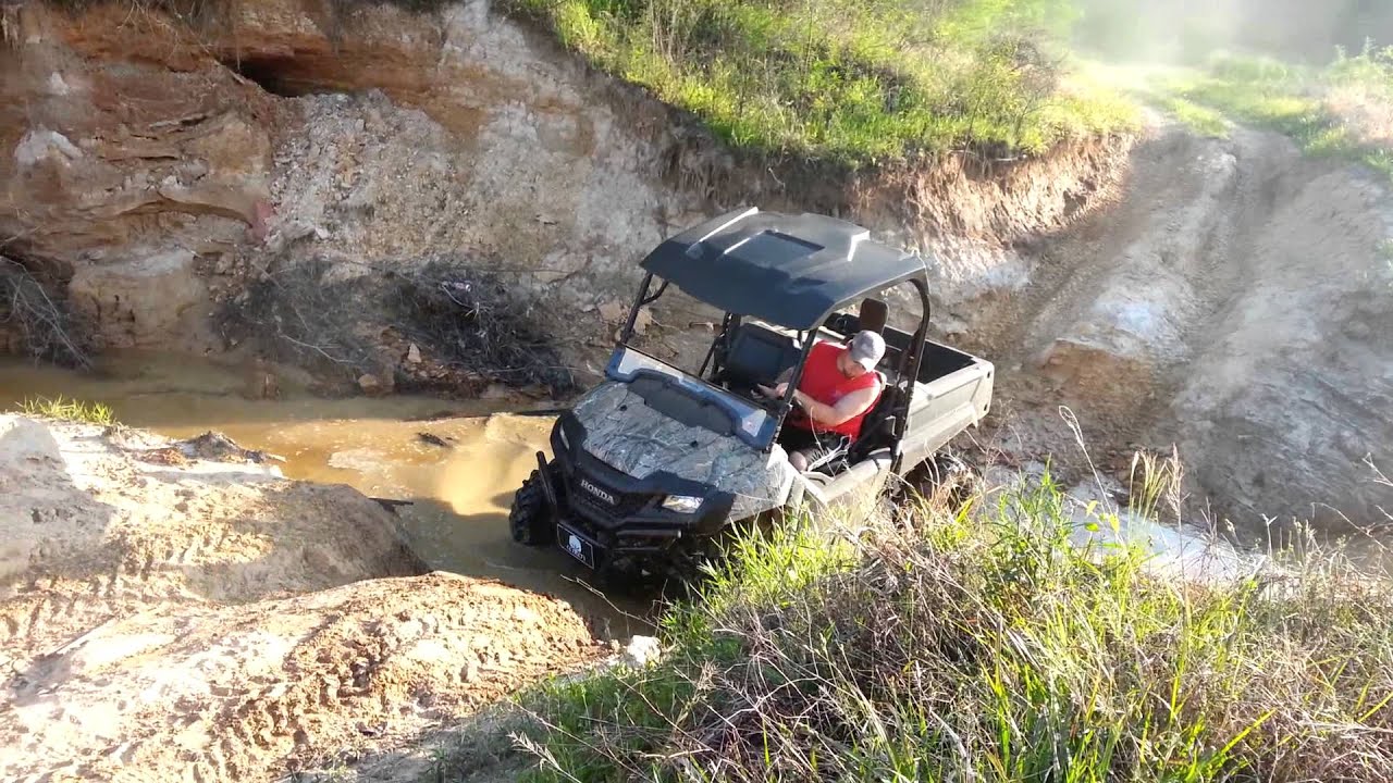 Honda Pioneer mud riding - YouTube