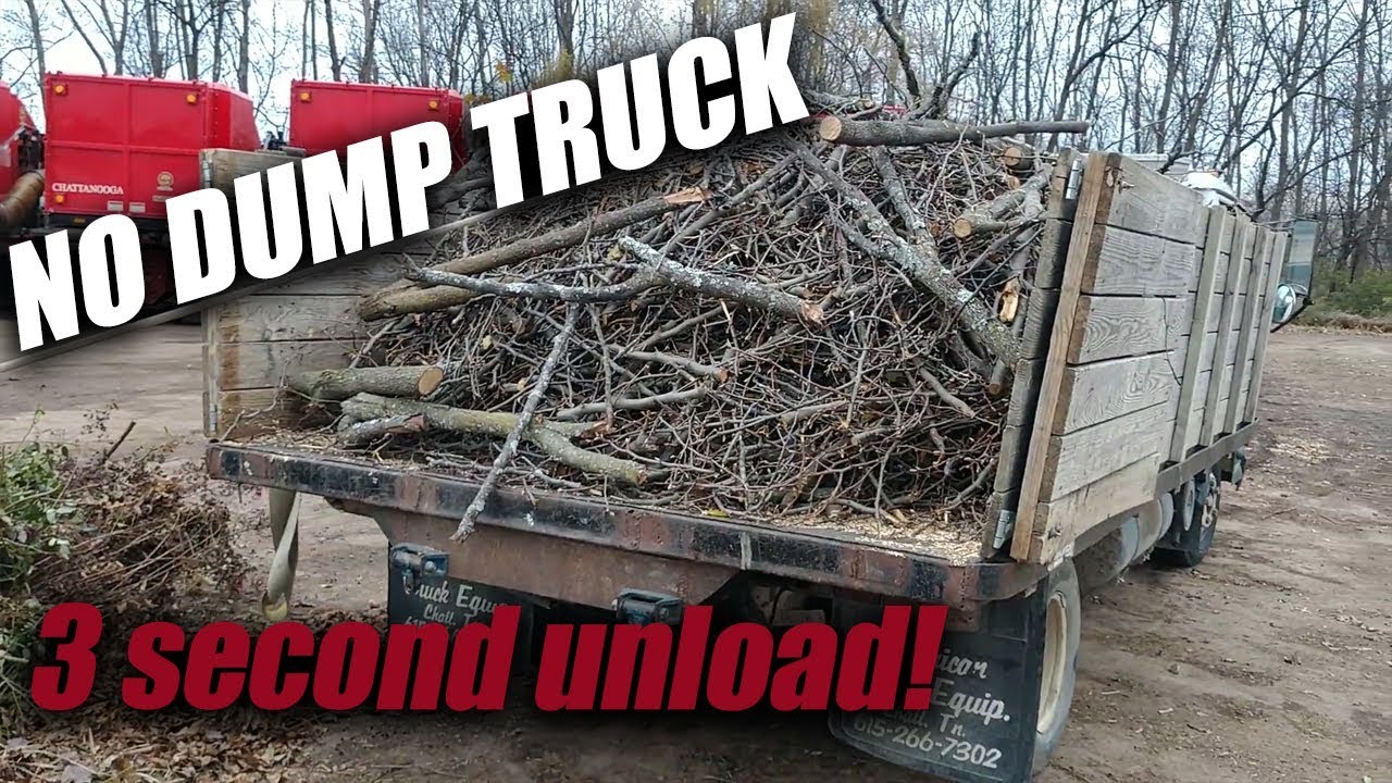 How to QUICKLY unload a trailer of brush - YouTube