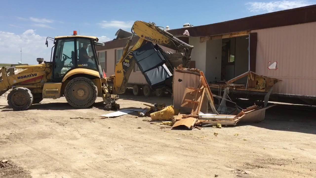 Disposing a damaged mobile home - YouTube