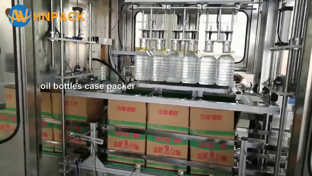 Hennopack top load carton packer for 5 litr oil bottol case packer ...