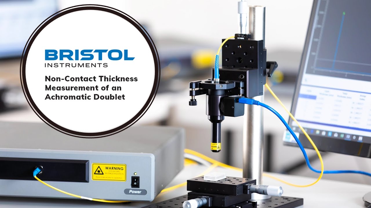 Non-contact thickness measurement of an optical doublet with the 157 ...