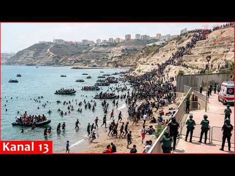 Crowd breaks through border from Spanish territory of Ceuta from Morocco