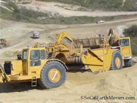 CAT 657E's push/pulling - YouTube