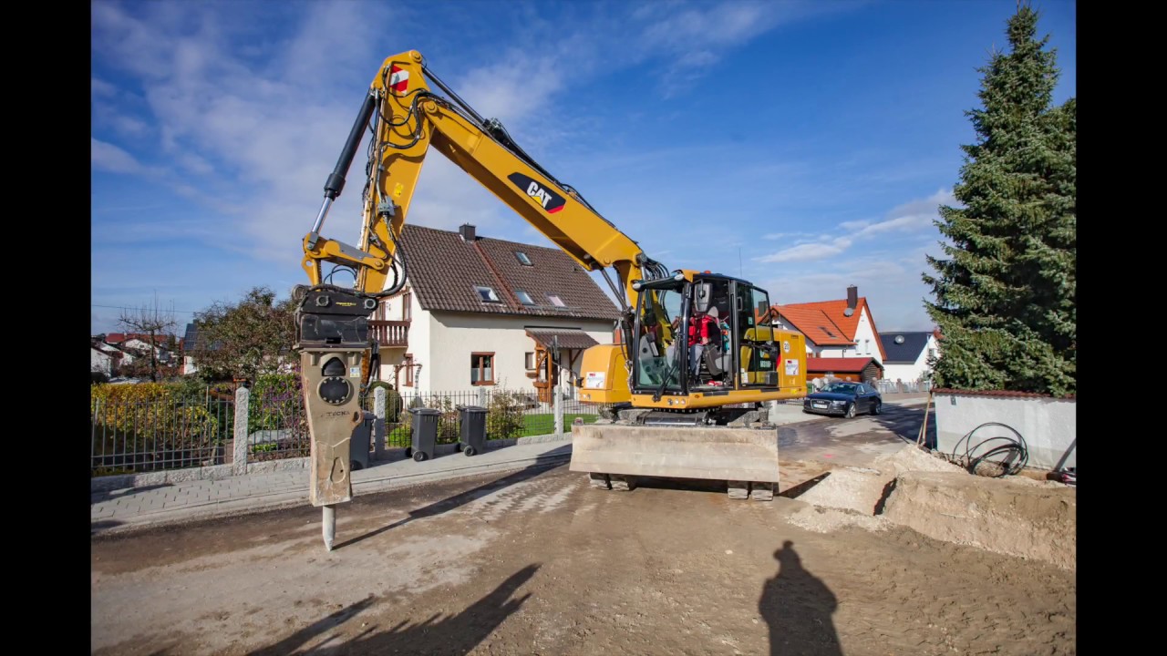 Cat M318F with engcon fully hydraulic Quick Coupler - YouTube