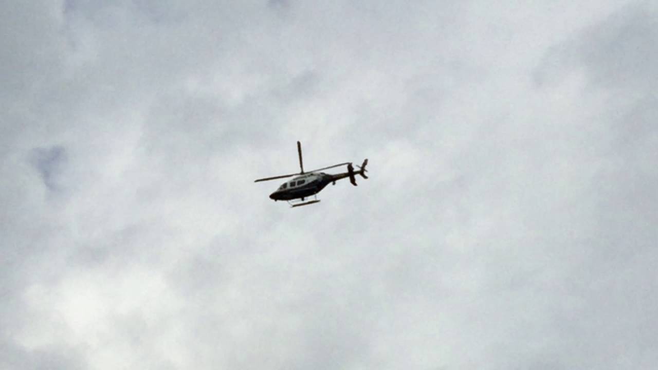 QUICK GLIMPSE OF A NYPD CHOPPER PATROLLING OVER THE BUSHWICK AREA OF ...