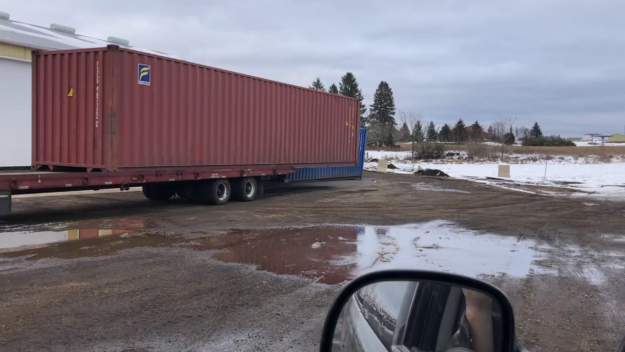 Unloading a 40’ container - YouTube
