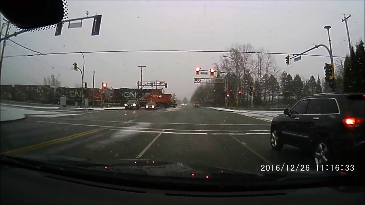 Car has a close call with a train - YouTube
