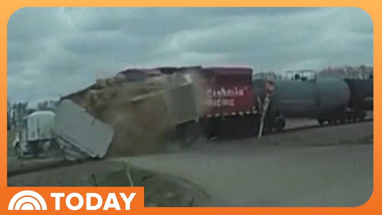 Video captures the moment a train splits semitruck in half - YouTube
