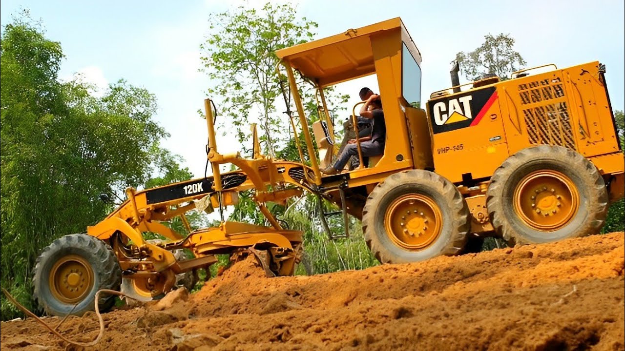 Grader Operator Preparing the Ground for a Soccer Field Construction ...