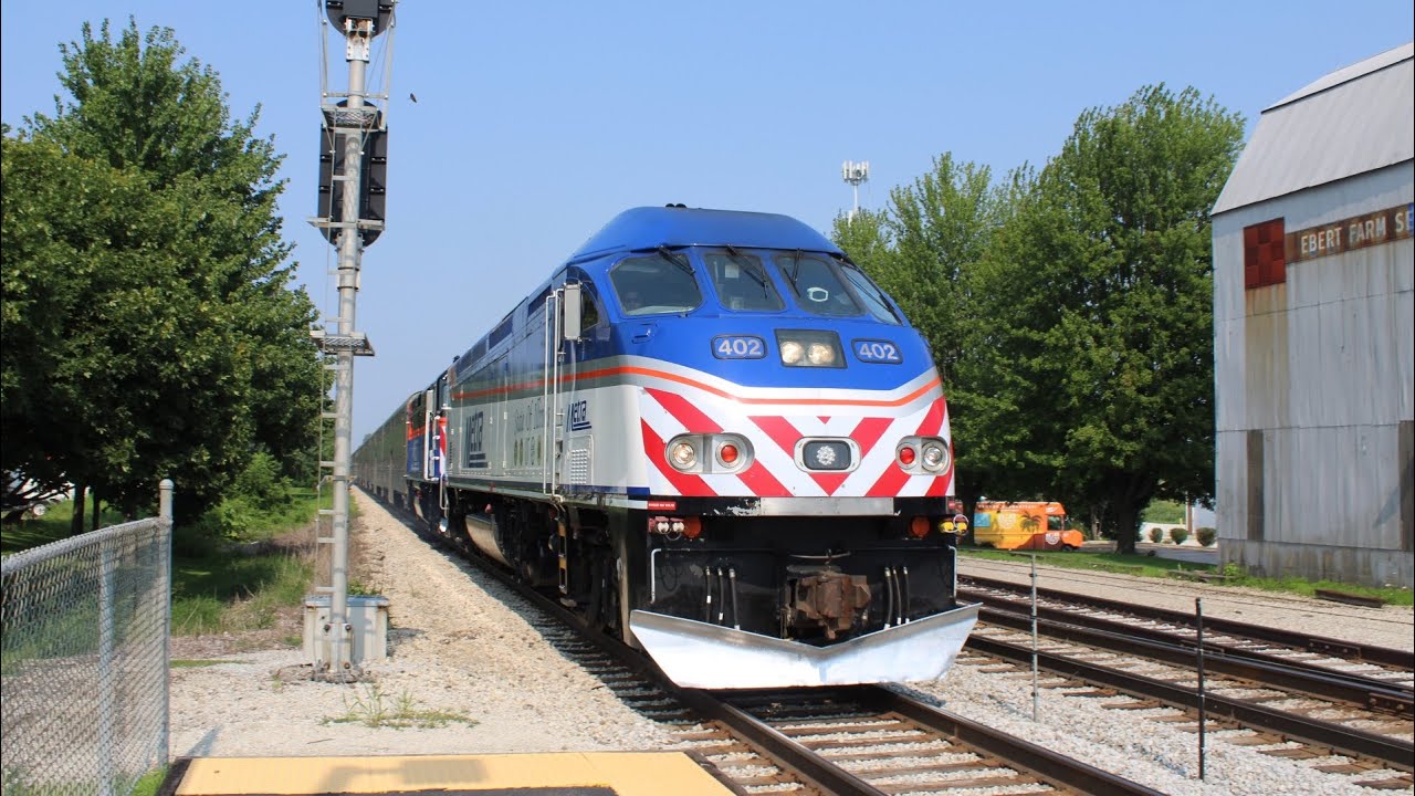 2 metra trains through front street (shortie) - YouTube
