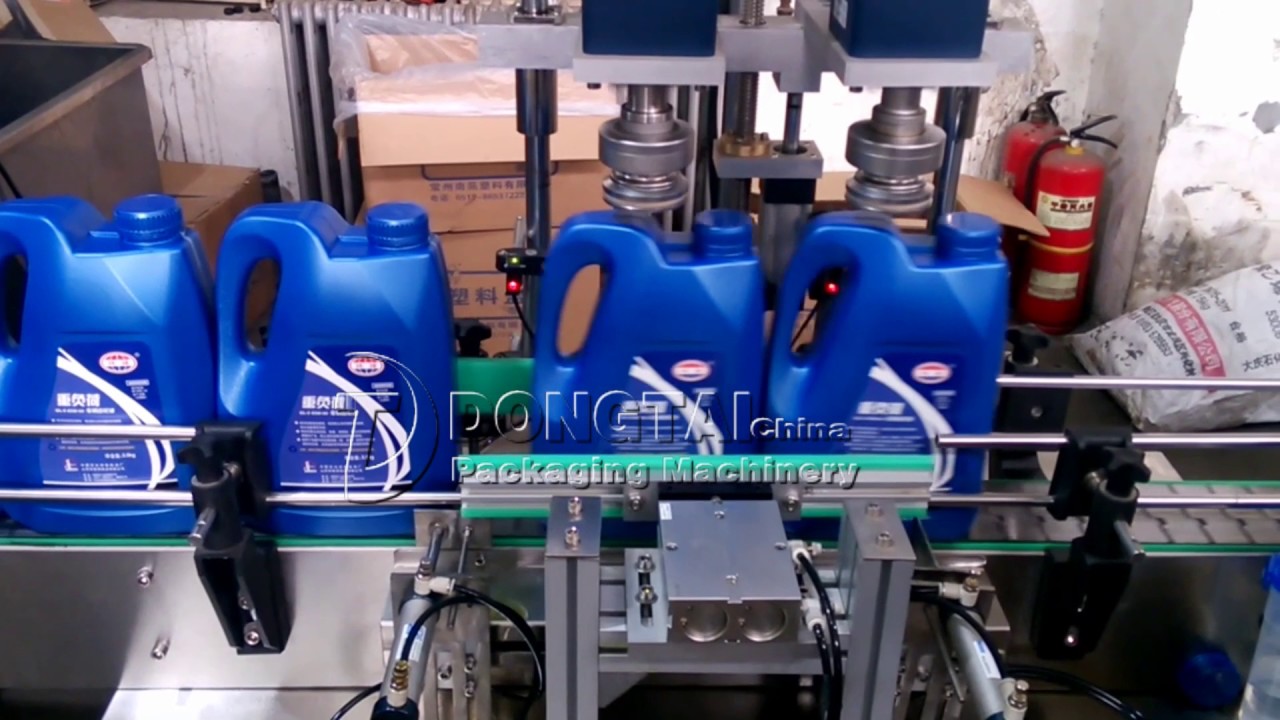 Lube oil filling line, filling, capping, packing - YouTube