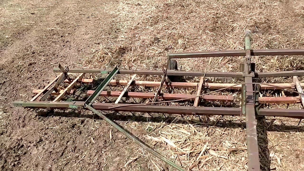 Dragging corn stalks and manure - YouTube