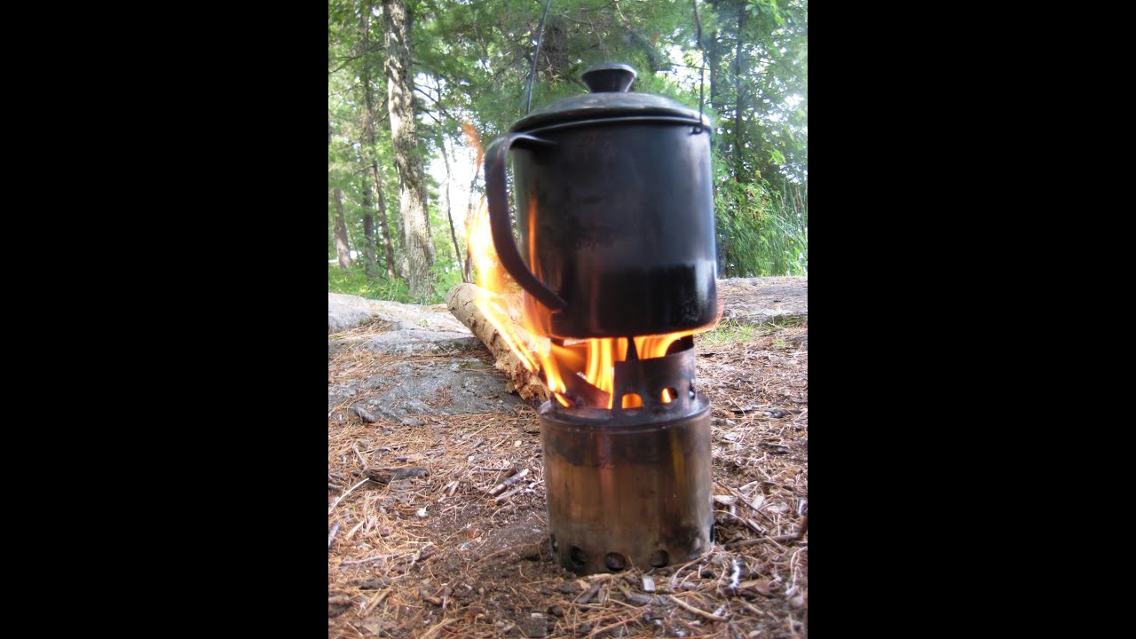 Lightweight cookset - an alcohol stove, a woodstove and a small pot ...