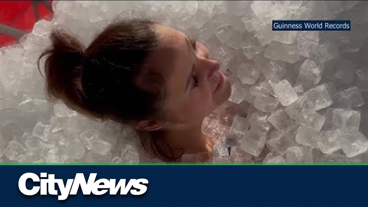 Woman sets record while encased in ice - YouTube
