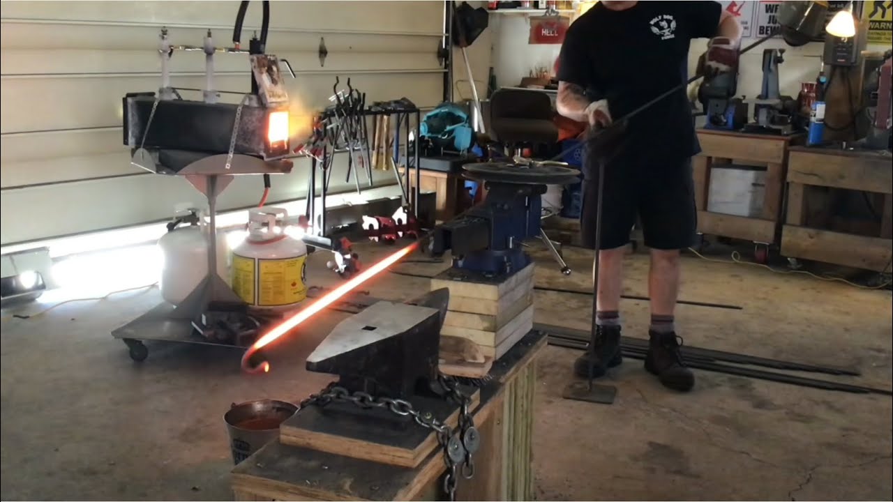 Forging shepherd hook plant hangers. - YouTube