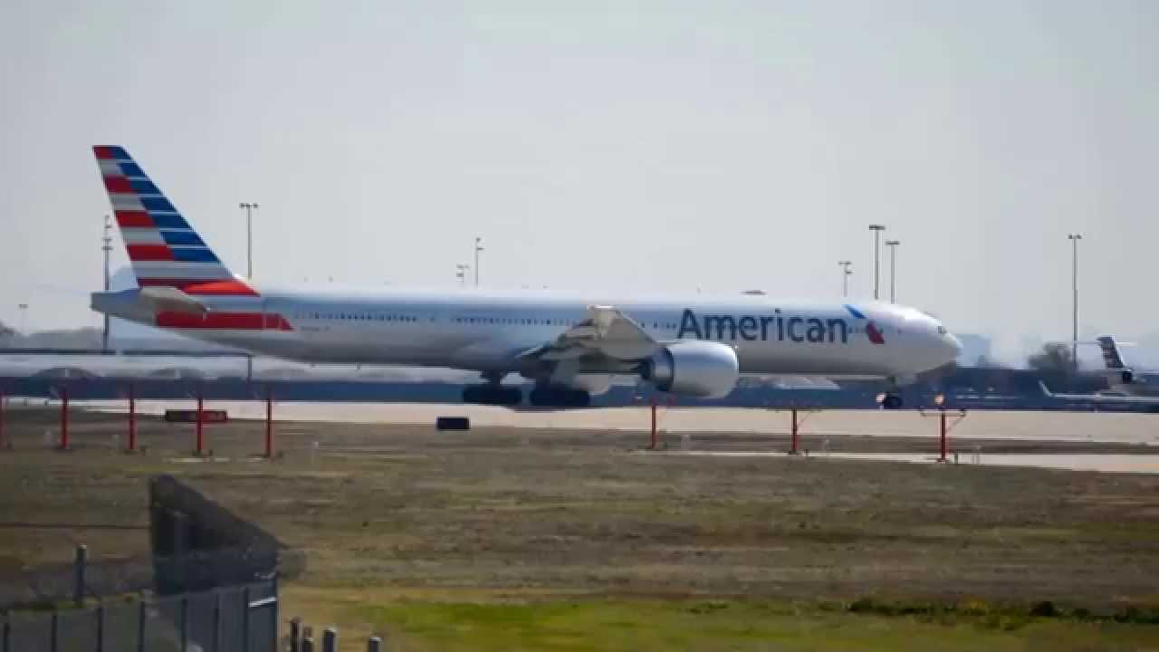 American Airlines 777-323(ER) (AA137) taking off at DFW International ...