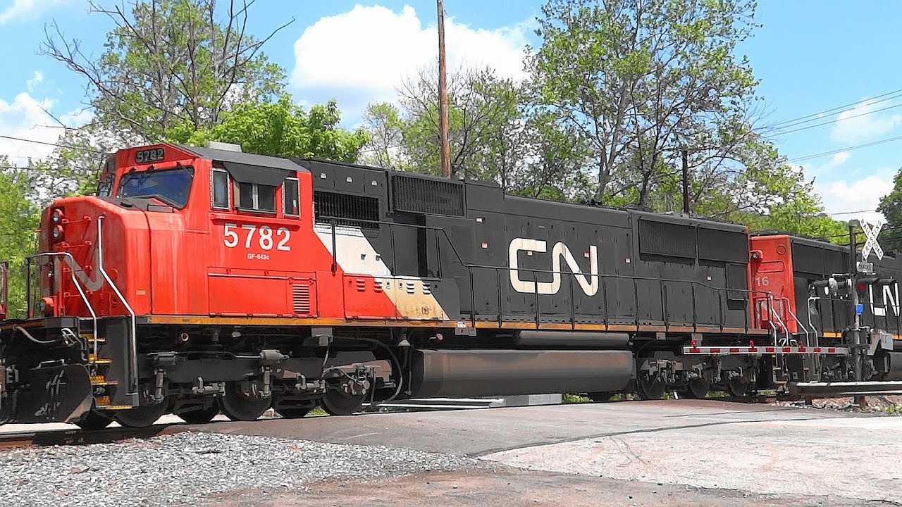 2 CSX Tank Trains Meet in Woodstock With CN EMD SD75's - YouTube