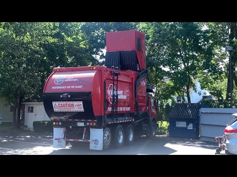 WIN waste innovations McNeilus FL dumping big red dumpsters - YouTube